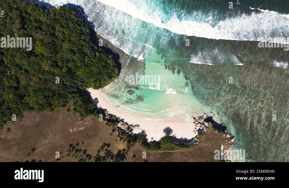 Overhead View Of Turquoise Beach With Foamy Waves In Pantai Watu Bella ...