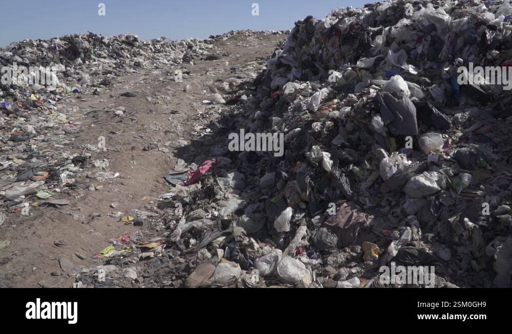 Slow motion view of loads of plastic in a waste dumping ground Stock ...