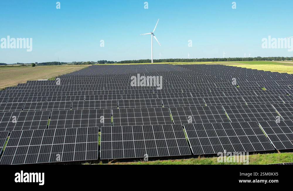Solar farm and wind turbines aerial view. Solar energy panels and wind ...