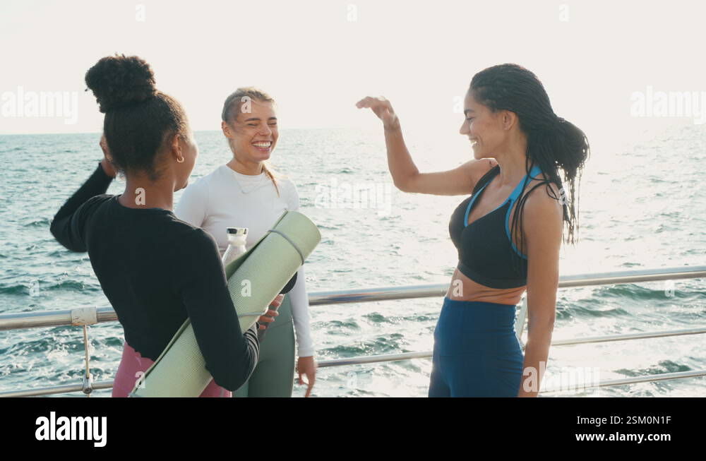 Women with athletic builds laugh highfiving each other Stock Video ...