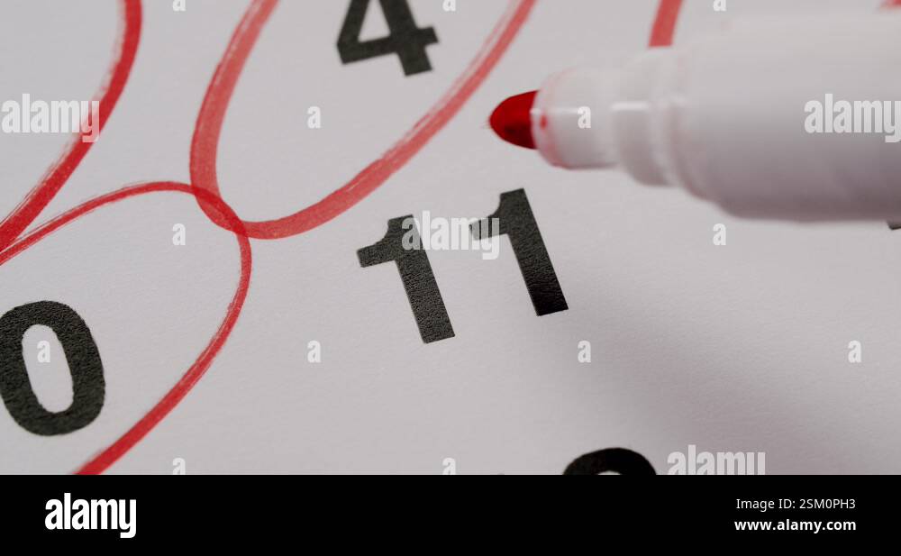 Person marking date circling red marker in calendar, closeup Stock ...