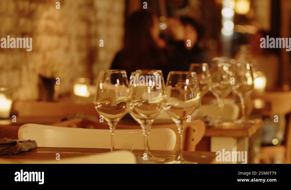 Evening cafe bar with a pleasant warm atmosphere and served tables with ...