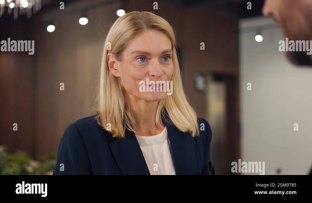 Female blonde applicant coming for job interview in well-known company ...