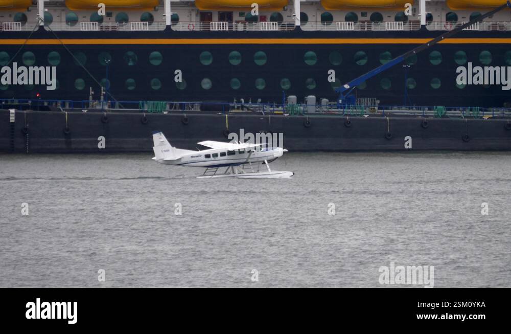 Cessna Caravan C208 Seaplane in the Harbor with Ships in Background ...