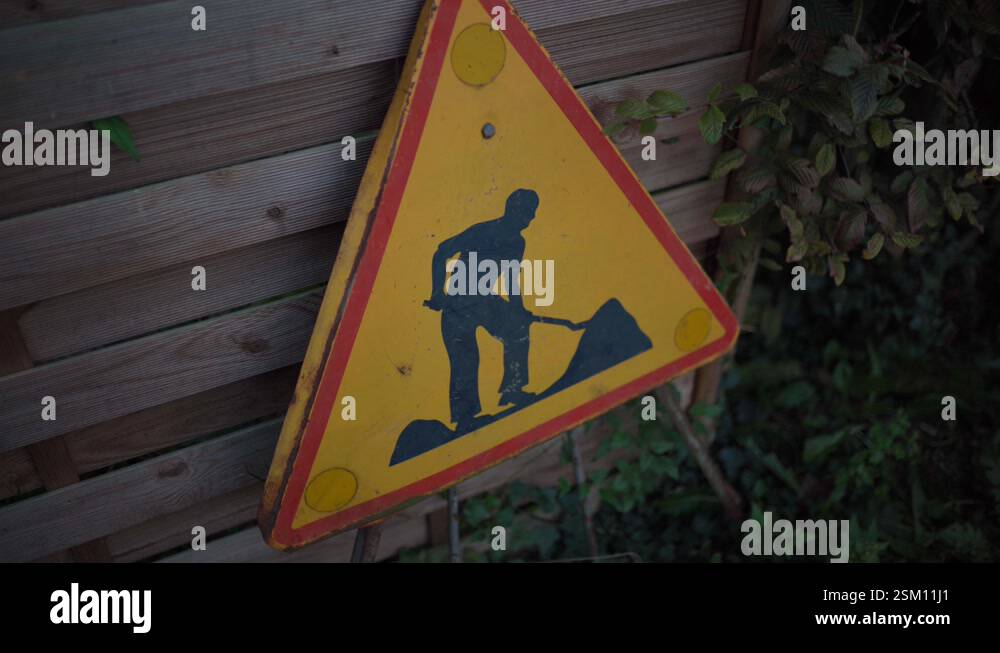 Yellow triangle with red border sign used in France. Road works ongoing ...