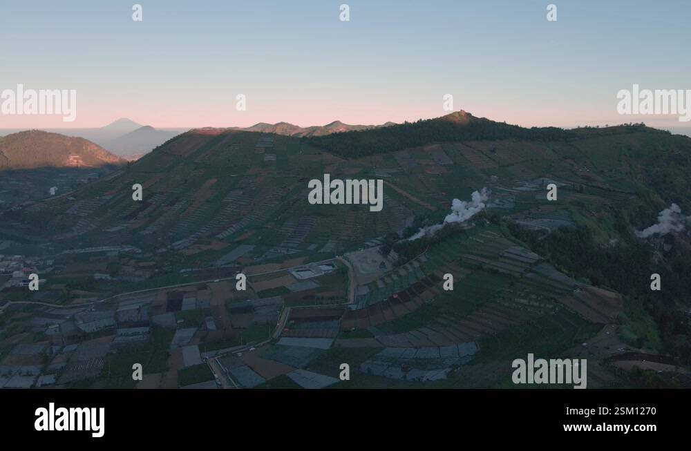 Vast highland landscape of Dieng regency, Indonesia. Aerial flyover ...