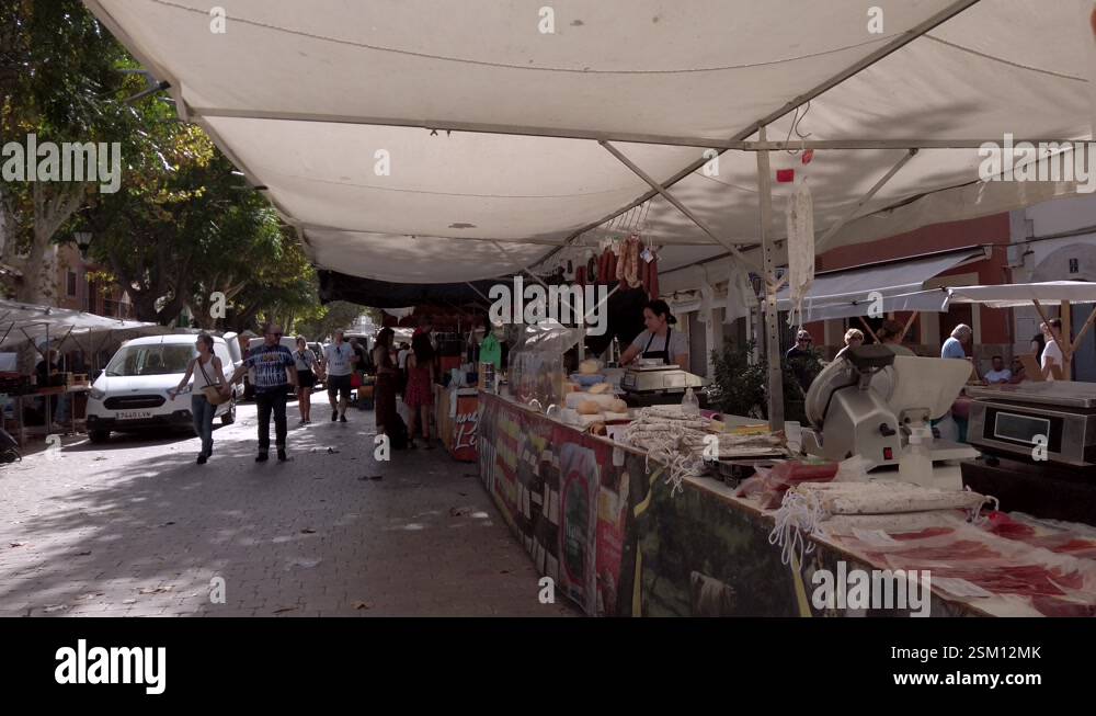 Spanish food market selling the Serrano Ham and Iberian Ham as well as ...