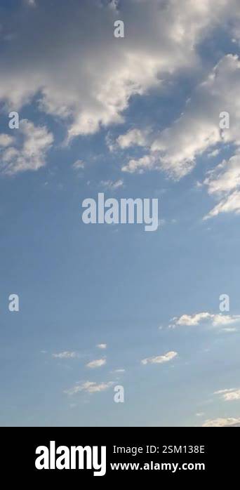 Light grey clouds soaring in the atmosphere slowly. Wind blows the ...