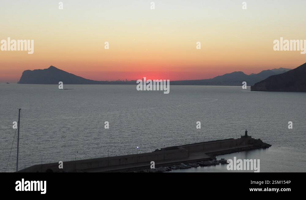 Calpe Spain sunset from Pina De IFac looking at the skyline of Benidorm ...
