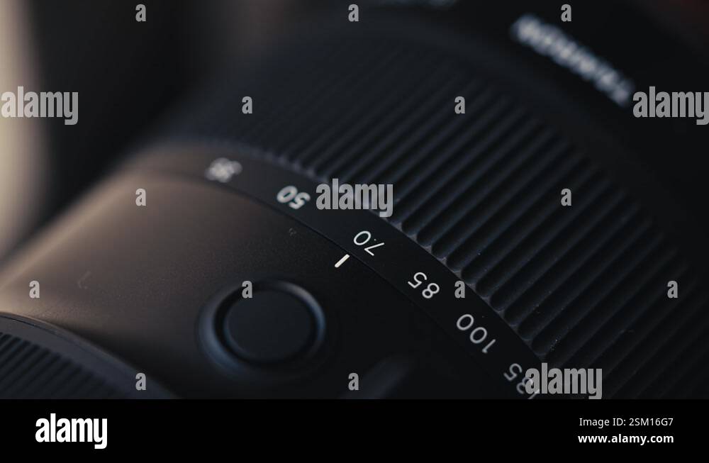 macro close up of the focal length numbers on a cameras zoom lens as ...