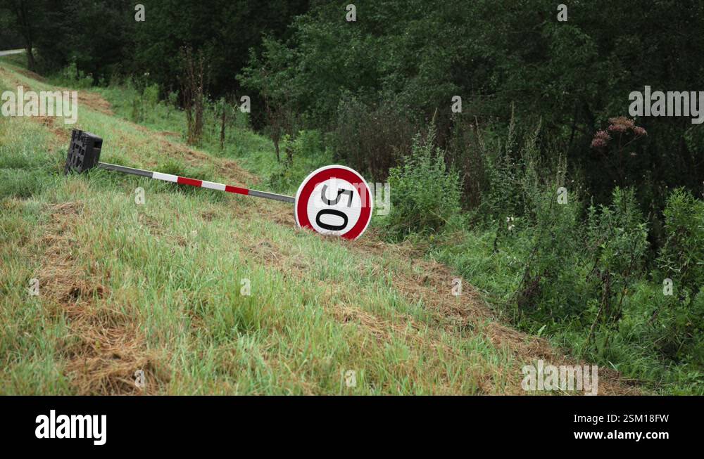 50 kilometer speed limit sign with red and white safety banding on side ...