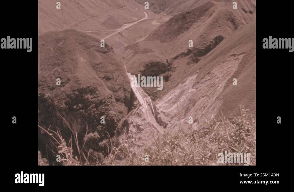 1960s: High angle of bridge over canyon, car driving Stock Video ...