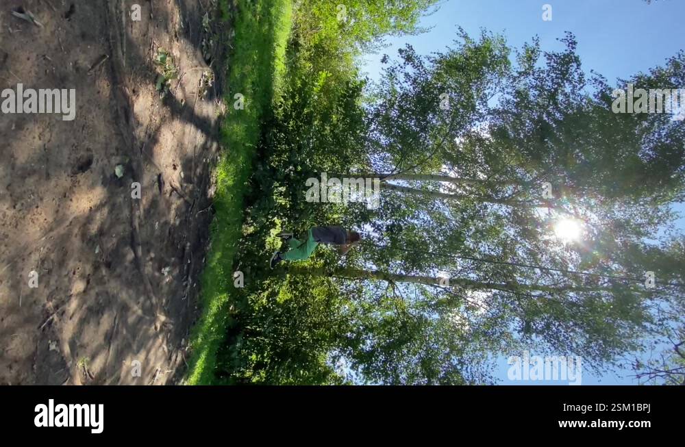 vertical video happy boy rides on a bungee, swing. boy swinging on a ...