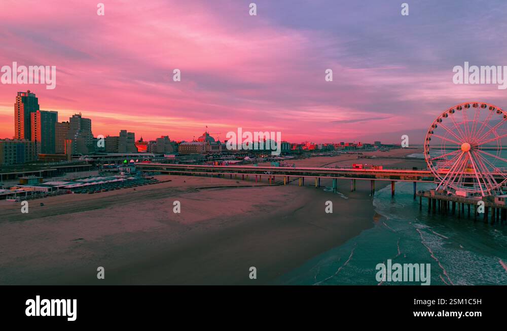 Sunset North Sea coast Scheveningen Pier Ferris wheel SkyView de Pier ...