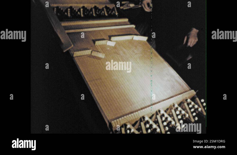 1960s: In his studio, composer Harry Partch plays a dulcimer-like ...