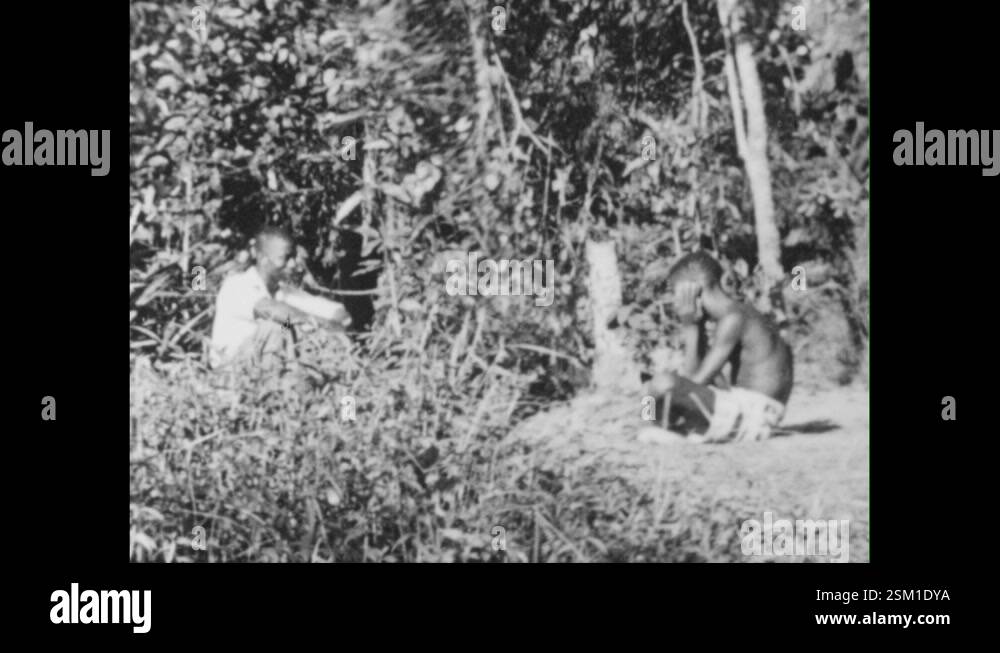 1940s: Boy traces shape of cross in dirt. Boy and man carry sick boy in ...