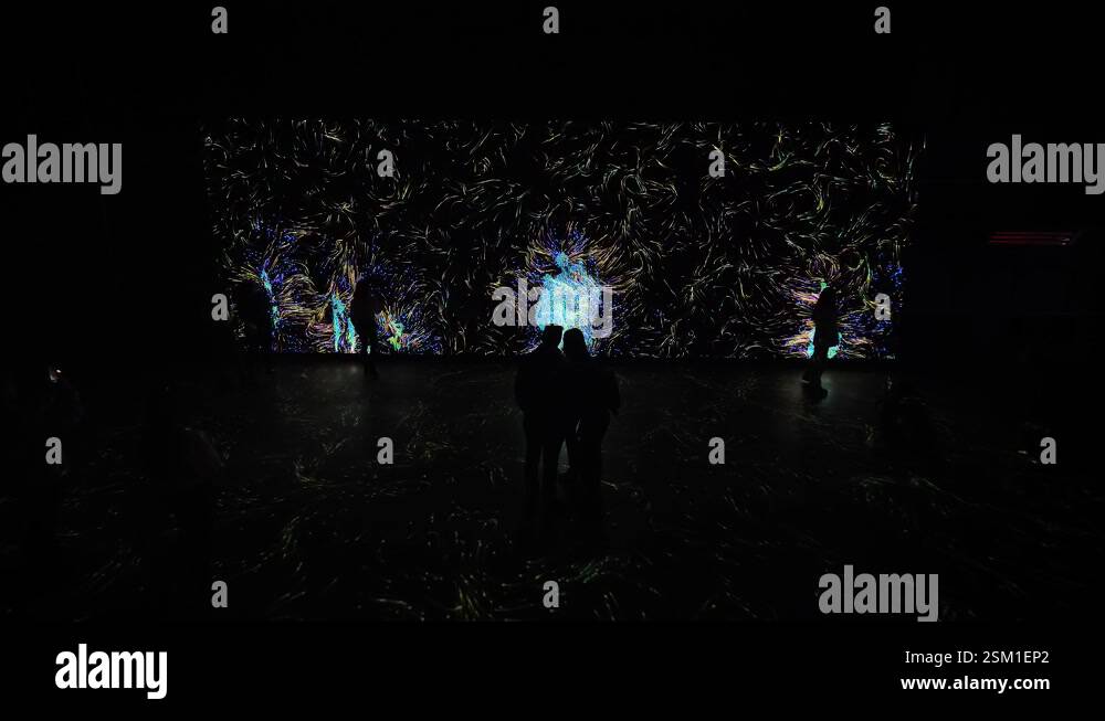 People moving in front of wide AR display with mirror effect at ...