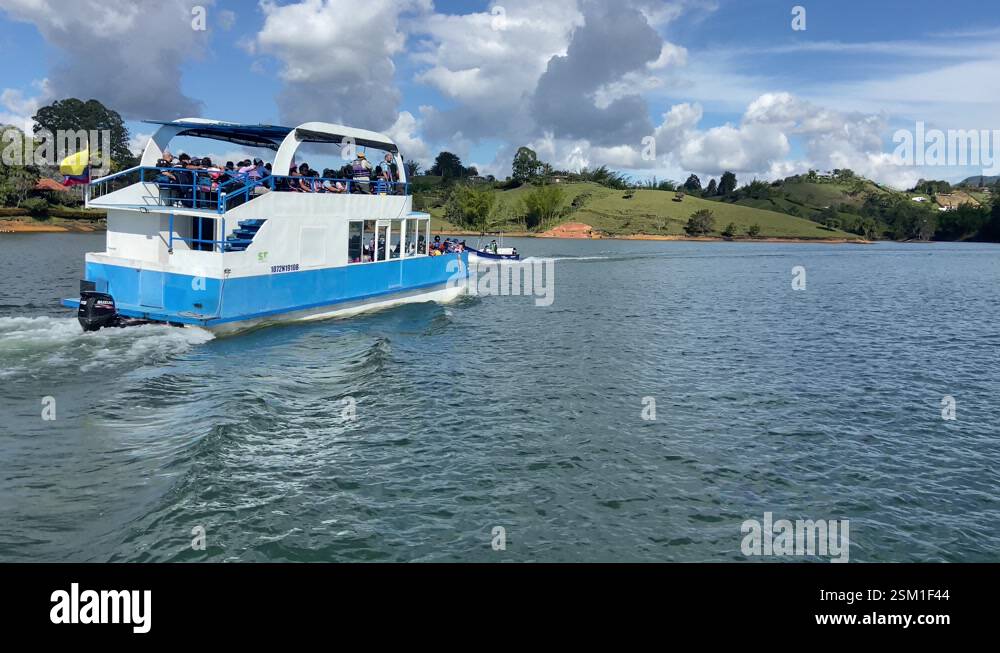 Touristic Colombian boat sailing in the lakes of Guatape, Medellin ...