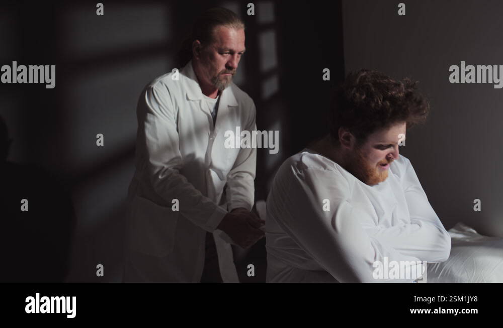 Doctor Restraining Patient With Use Of Straitjacket Stock Video Footage ...