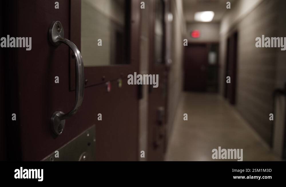 Prison door locked inside of jail or correctional facility Stock Video ...