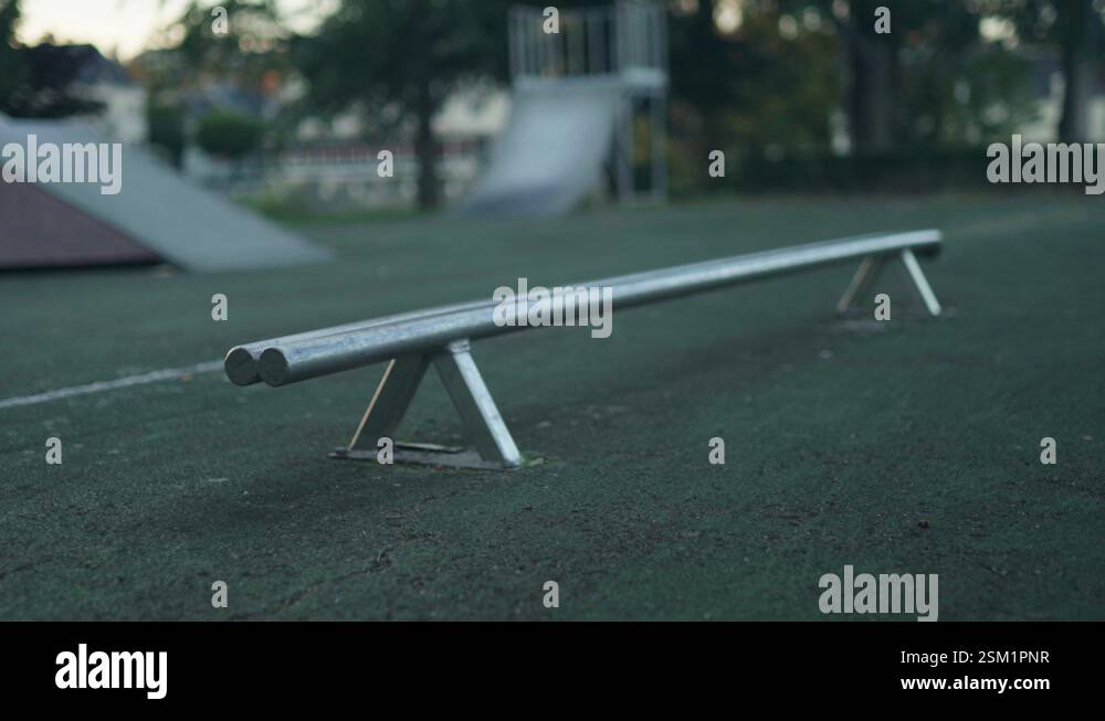 Metal railings in skate park. Skatepark fixtures and fittings. Handheld ...