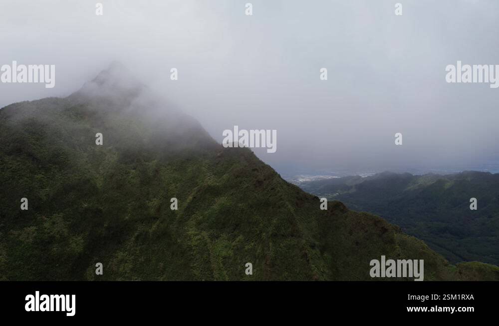 Nu‘uanu Pali area - Clouds over cliff slow push forward over ridge on a ...