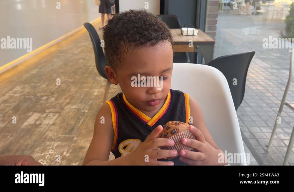 Boy eating muffin Stock Videos & Footage - HD and 4K Video Clips - Alamy