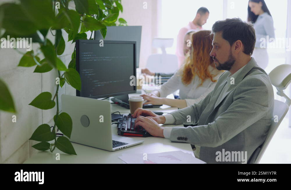 Male IT Programmer Working on Desktop Computer. Guy Writing Code in ...
