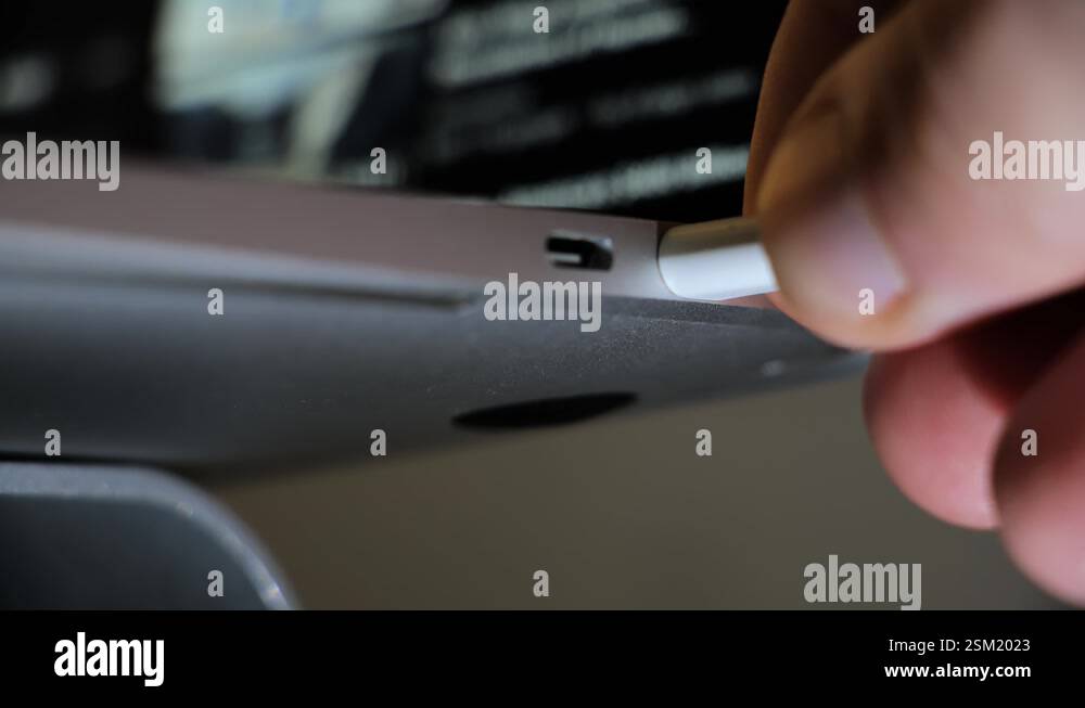 Struggling, missing, failing to insert cable into port. USB-C cable ...