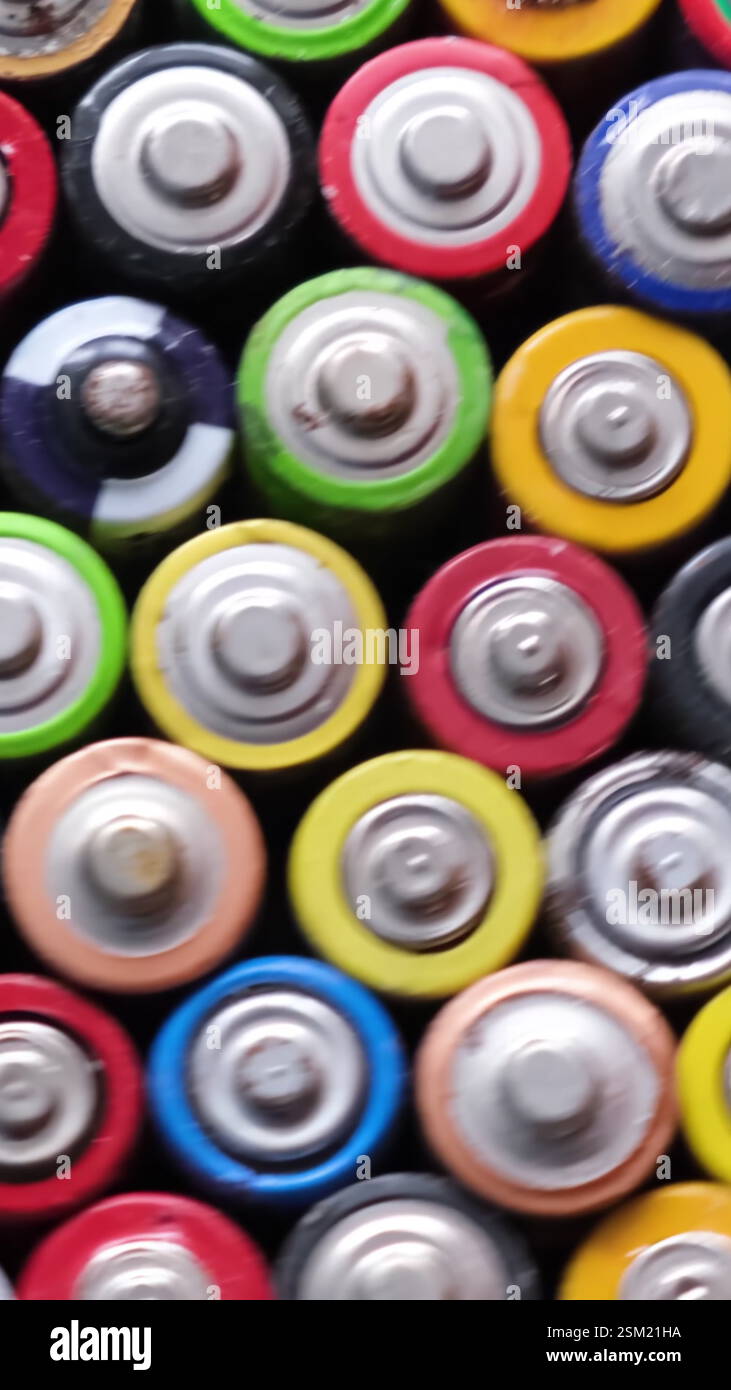 Close-up of used AA batteries. Finger batteries rotate in a circle ...
