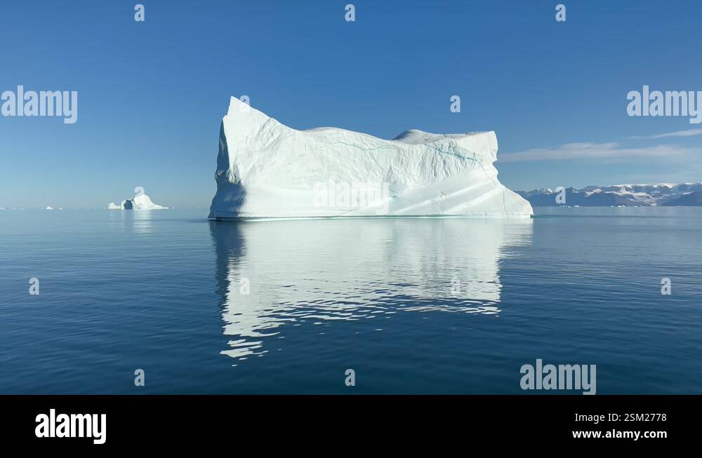 Interesting shape iceberg drifting in Nordvestfjord, Scoresbysund Stock ...