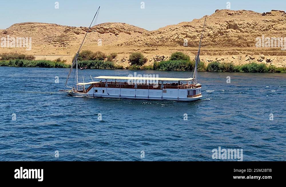 Nile Barge. Panoramic view of cruise ship sailing on the Nile River ...