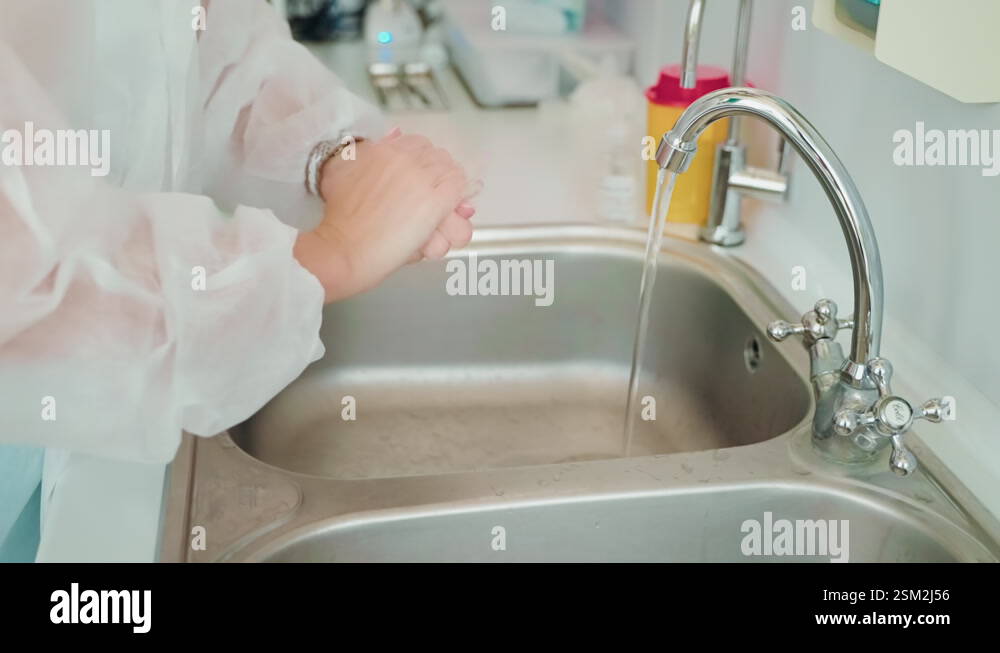 doctor or nurse washing hands before or after patients appointment in ...