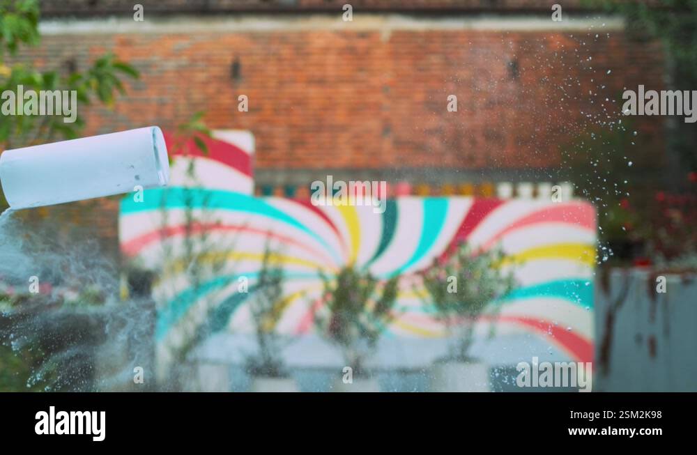 spinning glass releases liquid into the air, creating a mesmerizing ...