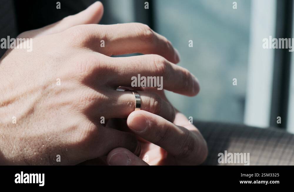 male hand twists a ring on his finger close-up of hands Stock Video ...