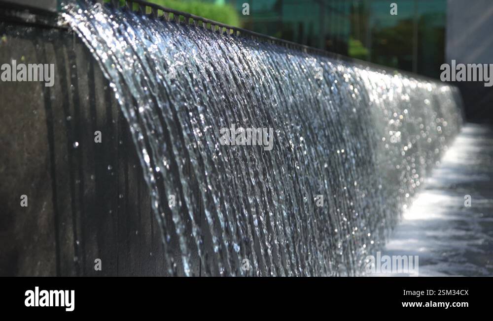 Waterfall Cascading Over a Stone Wall at Whitby Public Library in the ...