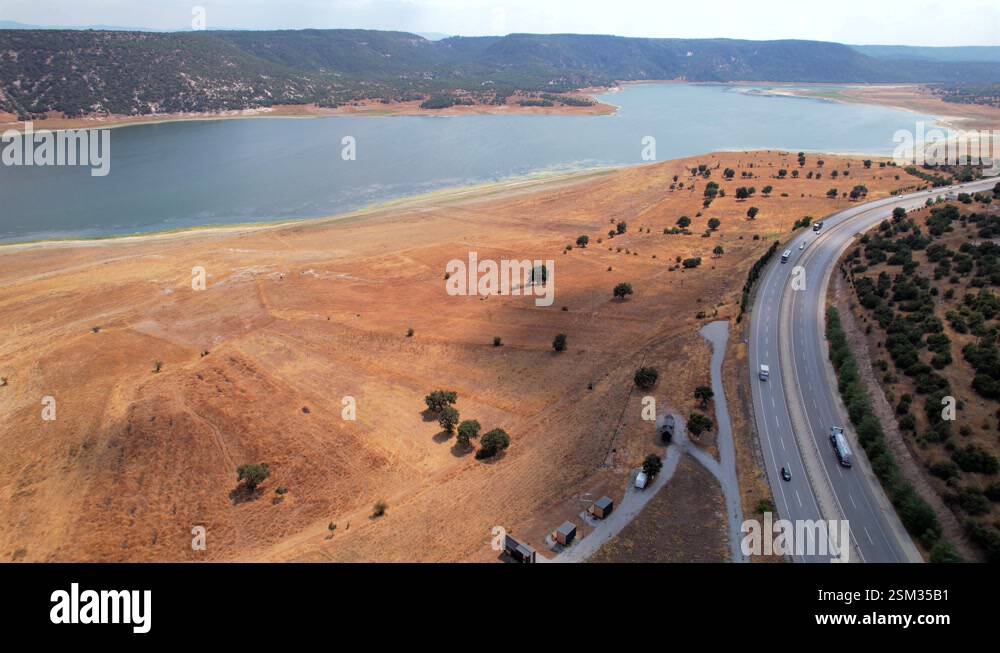 Sweeping Drone View of Shrinking Lake with Dry Beds, Arid Stock Video ...