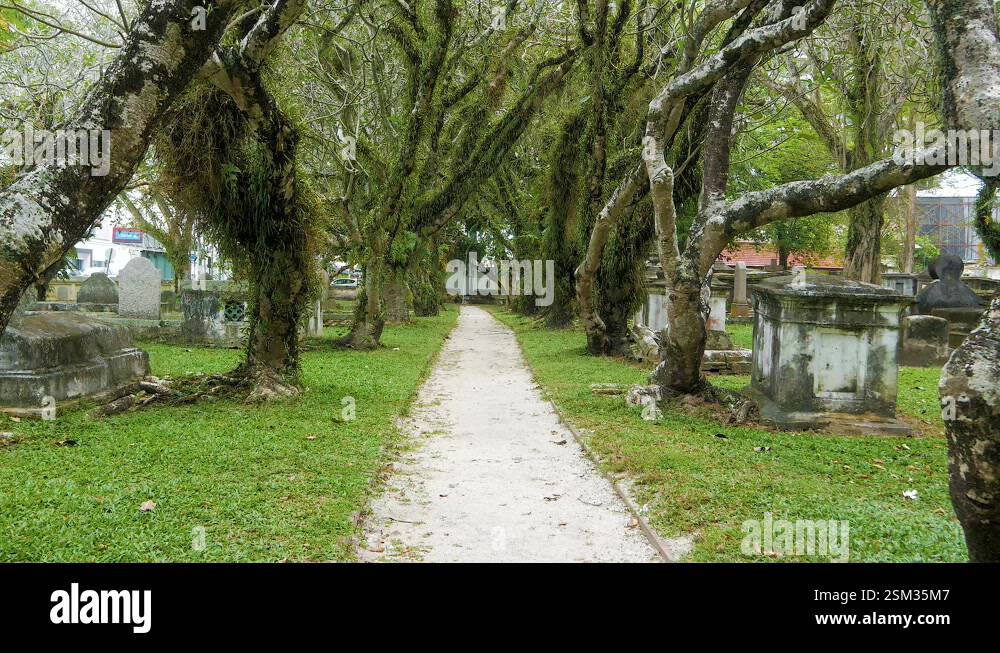Pathway through the centre of an old church graveyard on sacred ground ...
