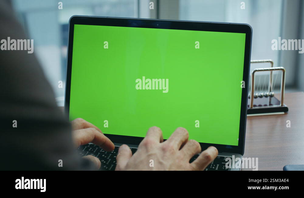 Hands typing green screen computer writing text on keyboard at ...