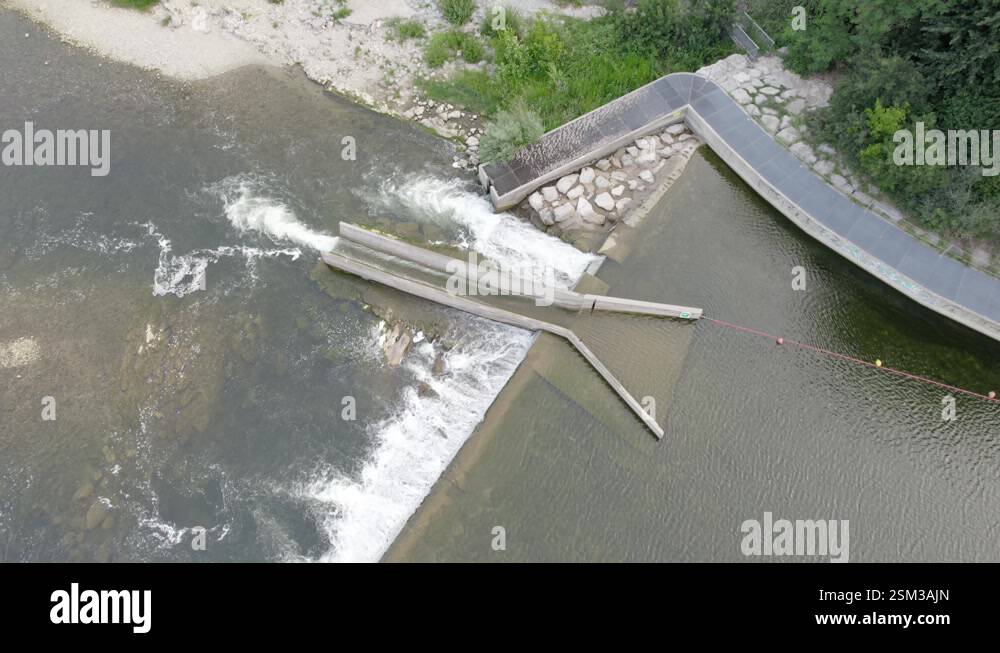 Water Flows Down The Man-made Dike With A Canoe Slide to The River ...