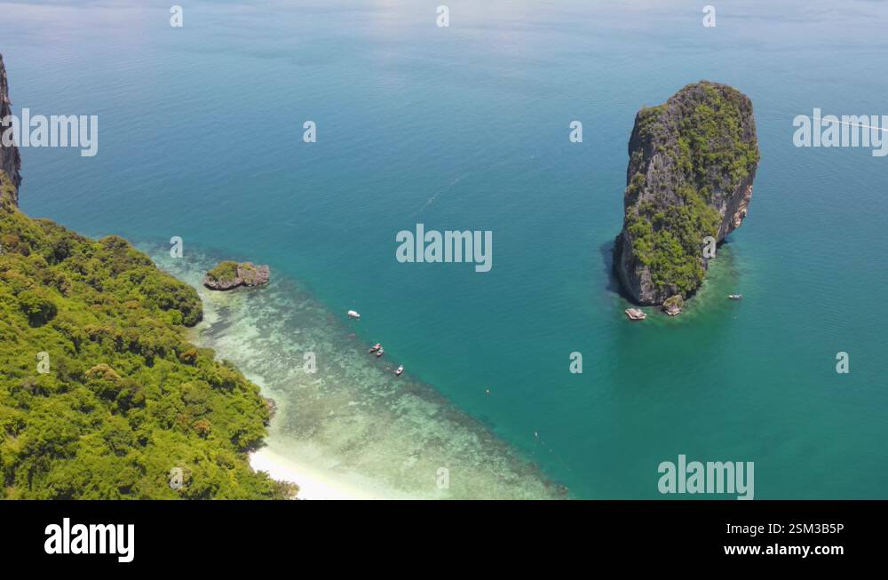 Famous limestone cliff in Ocean with coral reefs and clear water, Koh ...