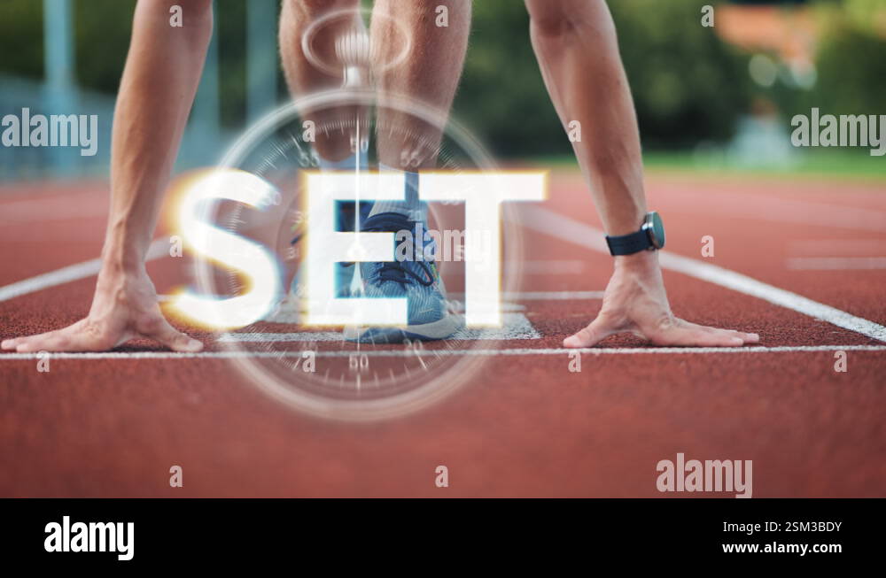 Timepiece clock in front of professional runner at the start of track ...