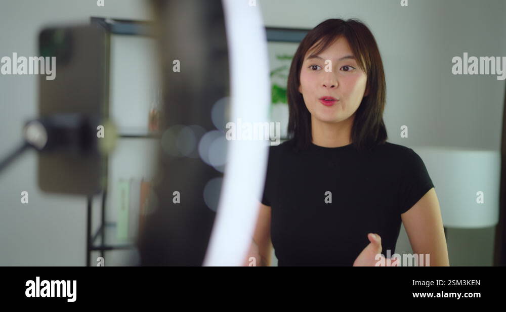 Female asian influencer live streaming at home Stock Video Footage - Alamy