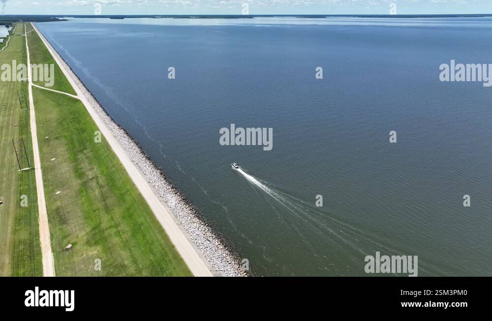 Boat passing by Lake Marion earthen Dam in South Carolina Stock Video ...