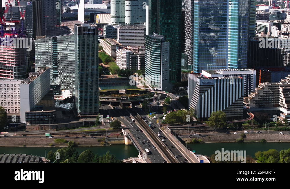 Heavy traffic on thoroughfares in modern business hub. Office steel and ...