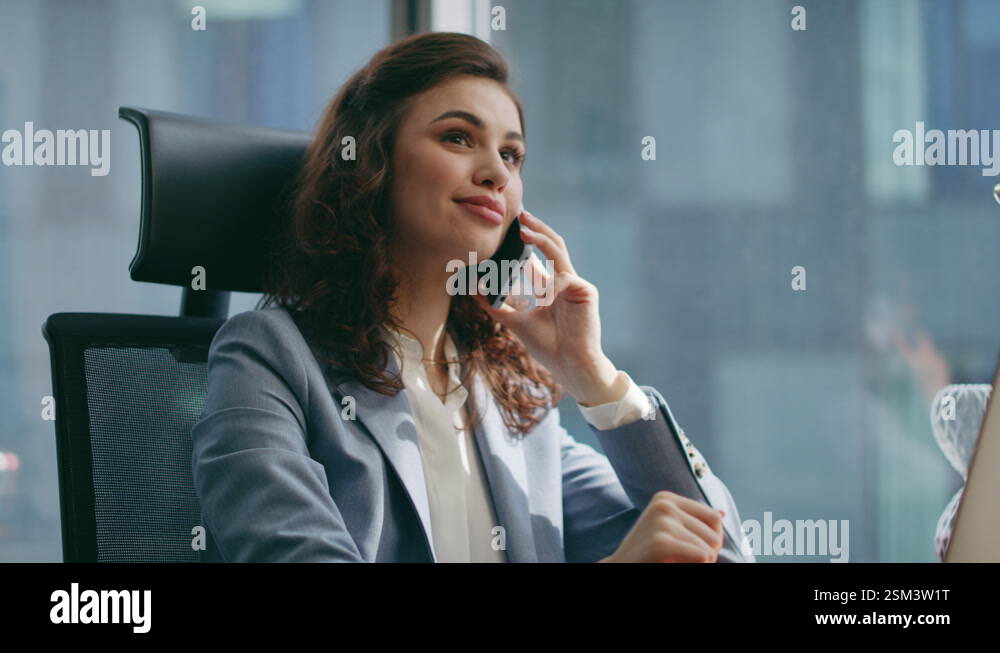 Girl business consultant calling sitting office desk with laptop close ...