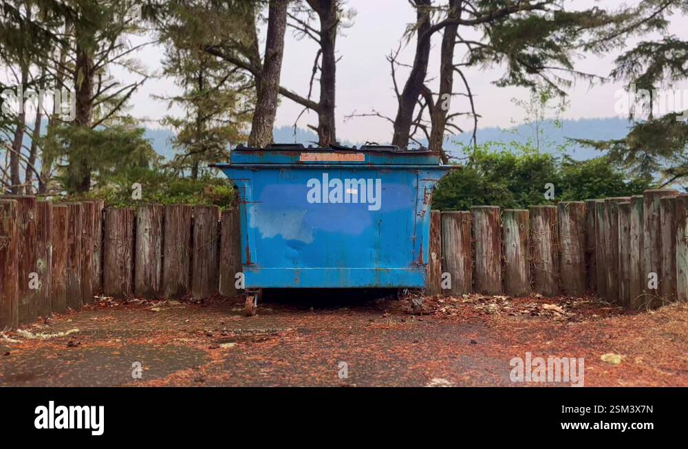 Blue Old Rusty Metal Garbage Bin With Nature Background In Oregon Coast ...