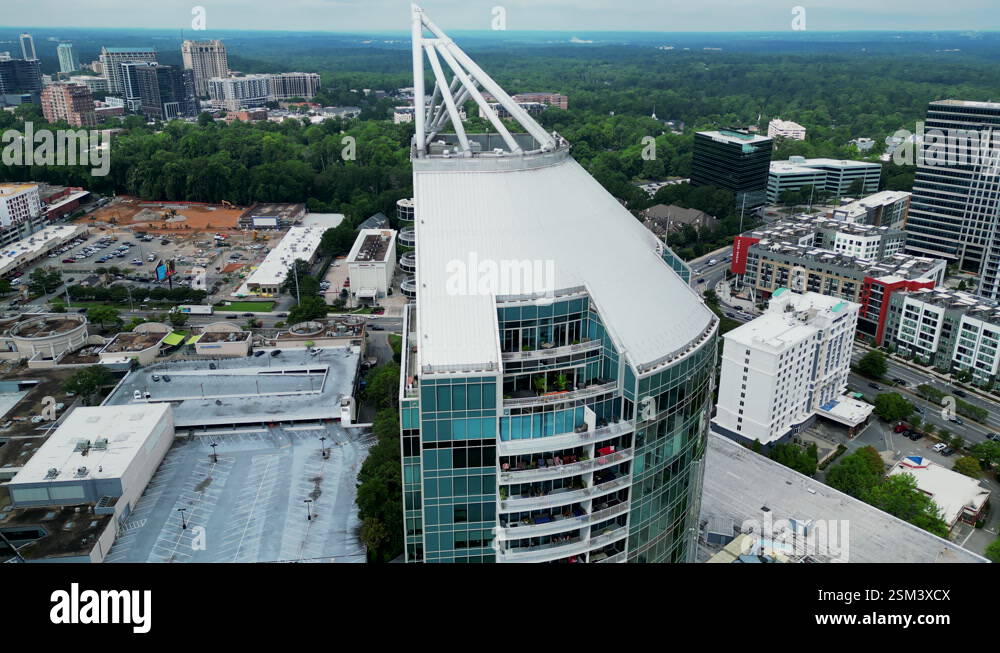 Aerial ascending footage of high rise apartment building. Revealing ...