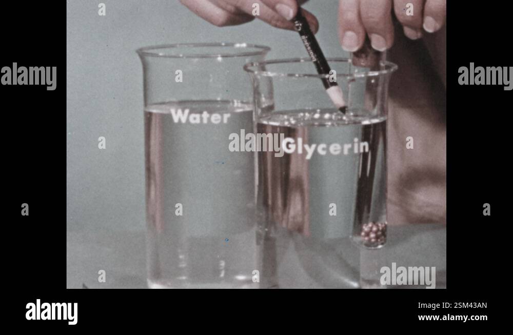 1960s: Person places weighted test tube in glycerin. Person marks test ...
