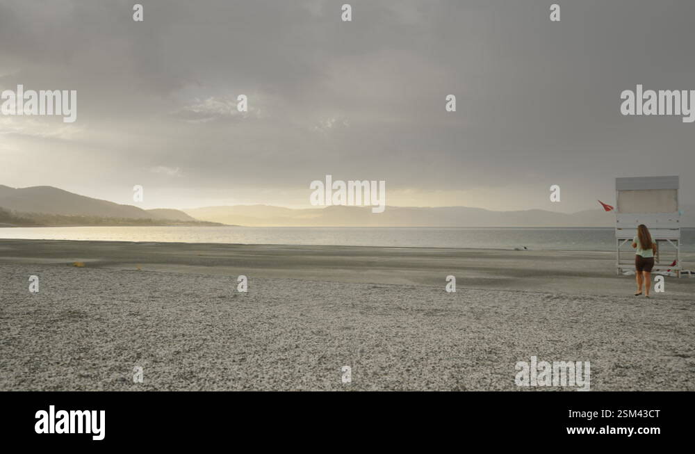 Cloudy weather, the sun has almost set behind the mountain, but despite ...